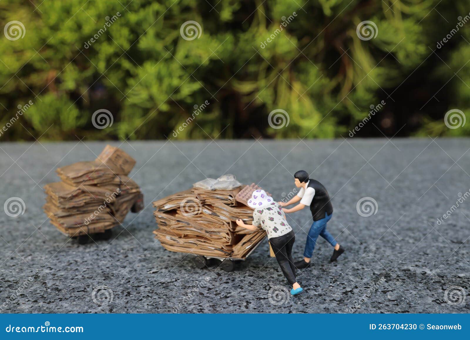 Mini Figure Pushes a Trolley Laden with Bags through Stock Photo ...