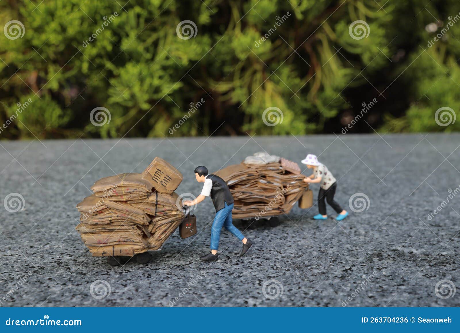 Mini Figure Pushes a Trolley Laden with Bags through Stock Photo ...