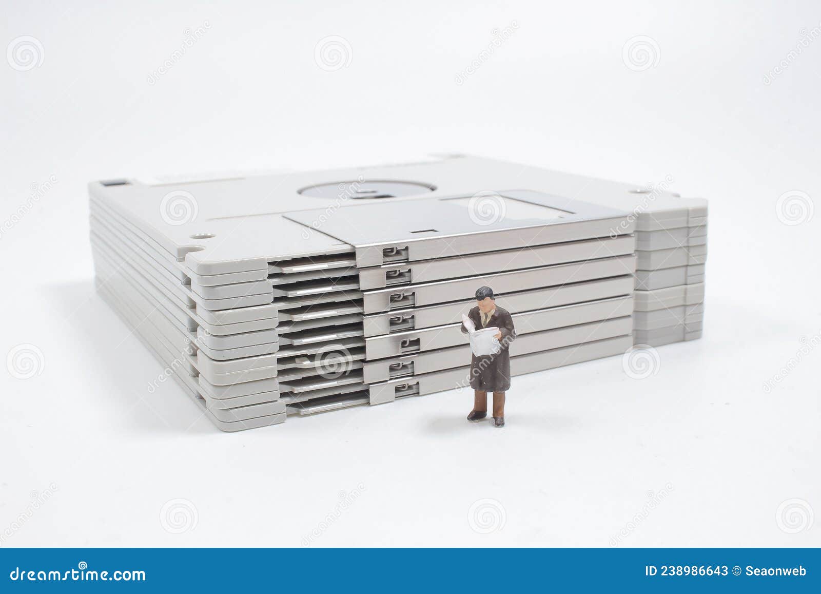A Mini of Figure Reading with the Floppy Disk Stock Image - Image of ...