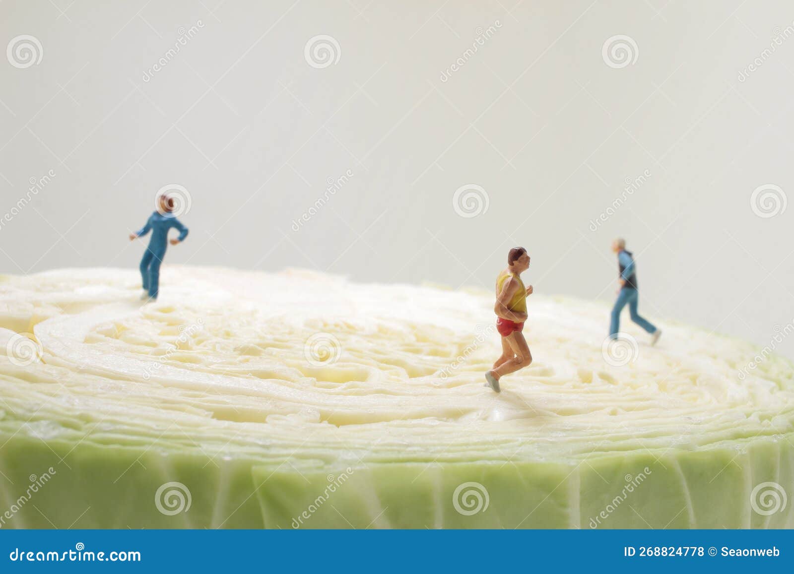 A Mini Figure Runner Running on Cabbage Stock Photo - Image of concept ...