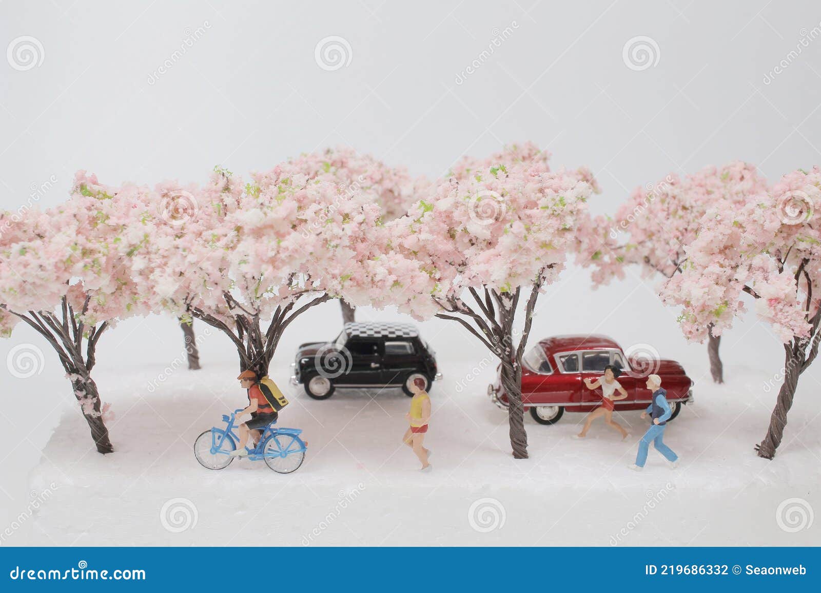 Mini Figure Running in Park with Cherry Blossoms in Bloom in Spring ...