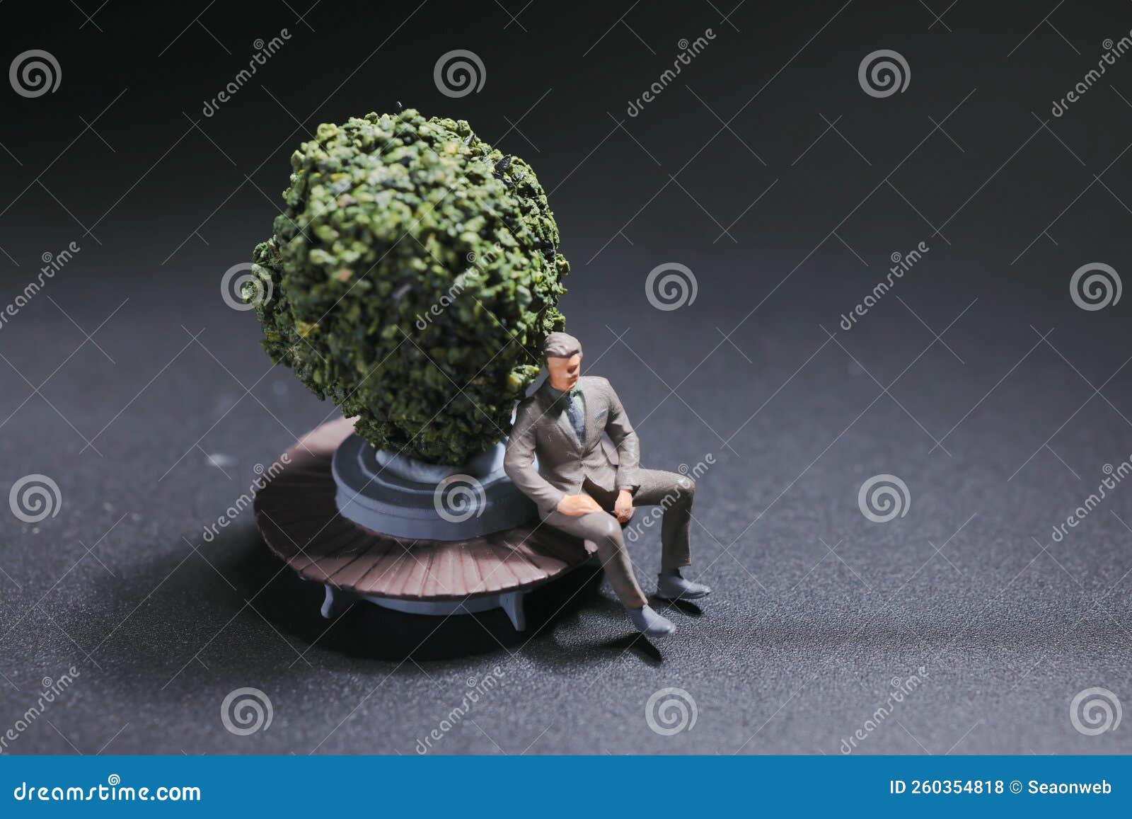 A Mini of Figure Sit on the Park Bench Stock Photo - Image of concept ...