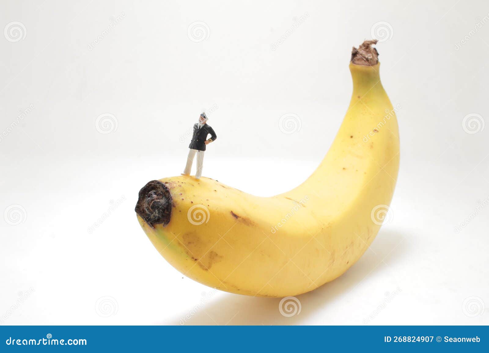 A Mini of Figure Stand on the Banana Stock Image - Image of snack ...