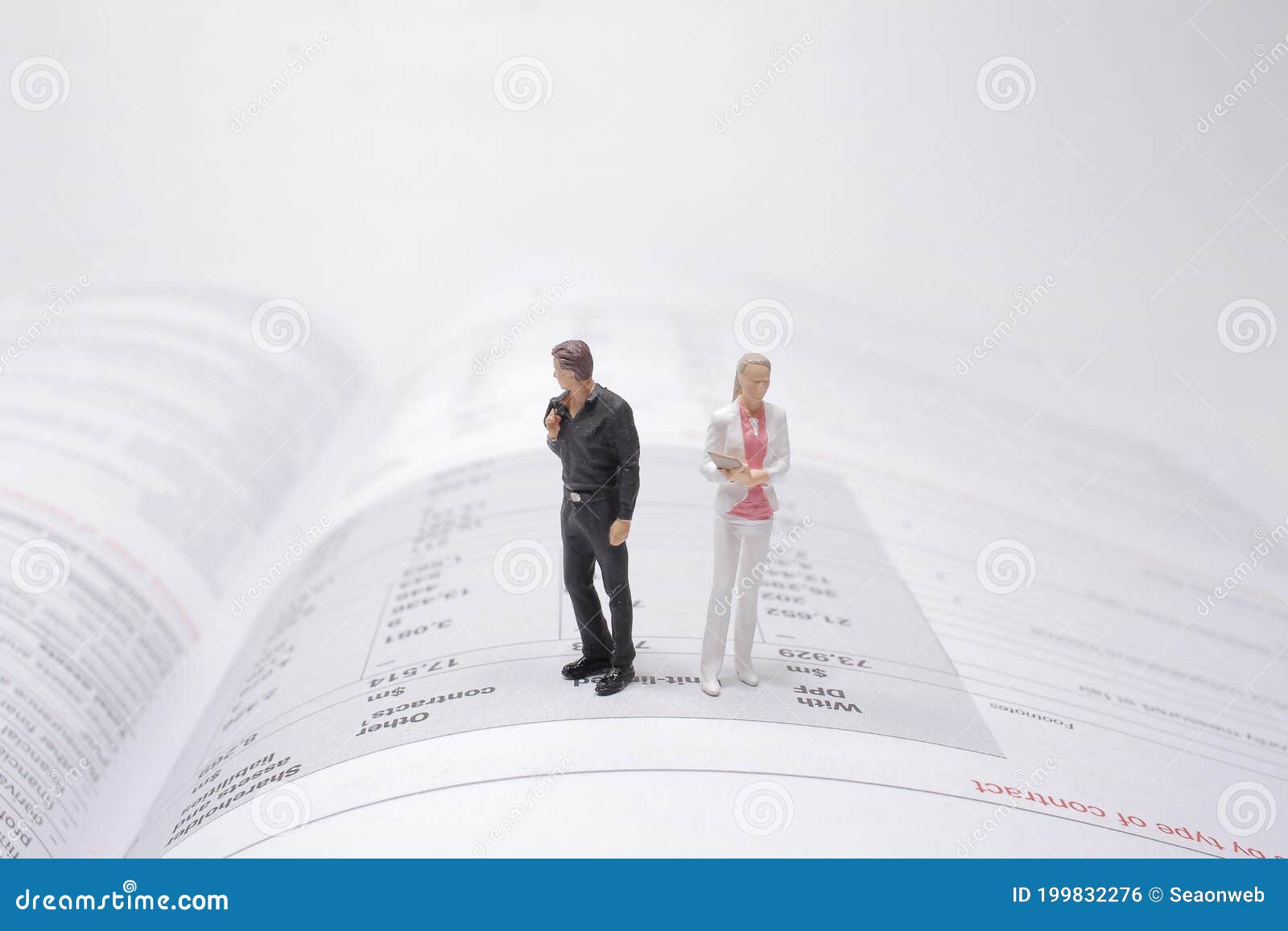 A Mini Figure Stand on the Open Book Stock Photo - Image of number ...