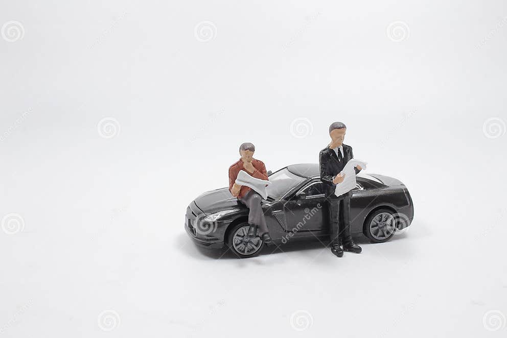 A Mini Figure Standing and Reading Newspaper Stock Image - Image of ...