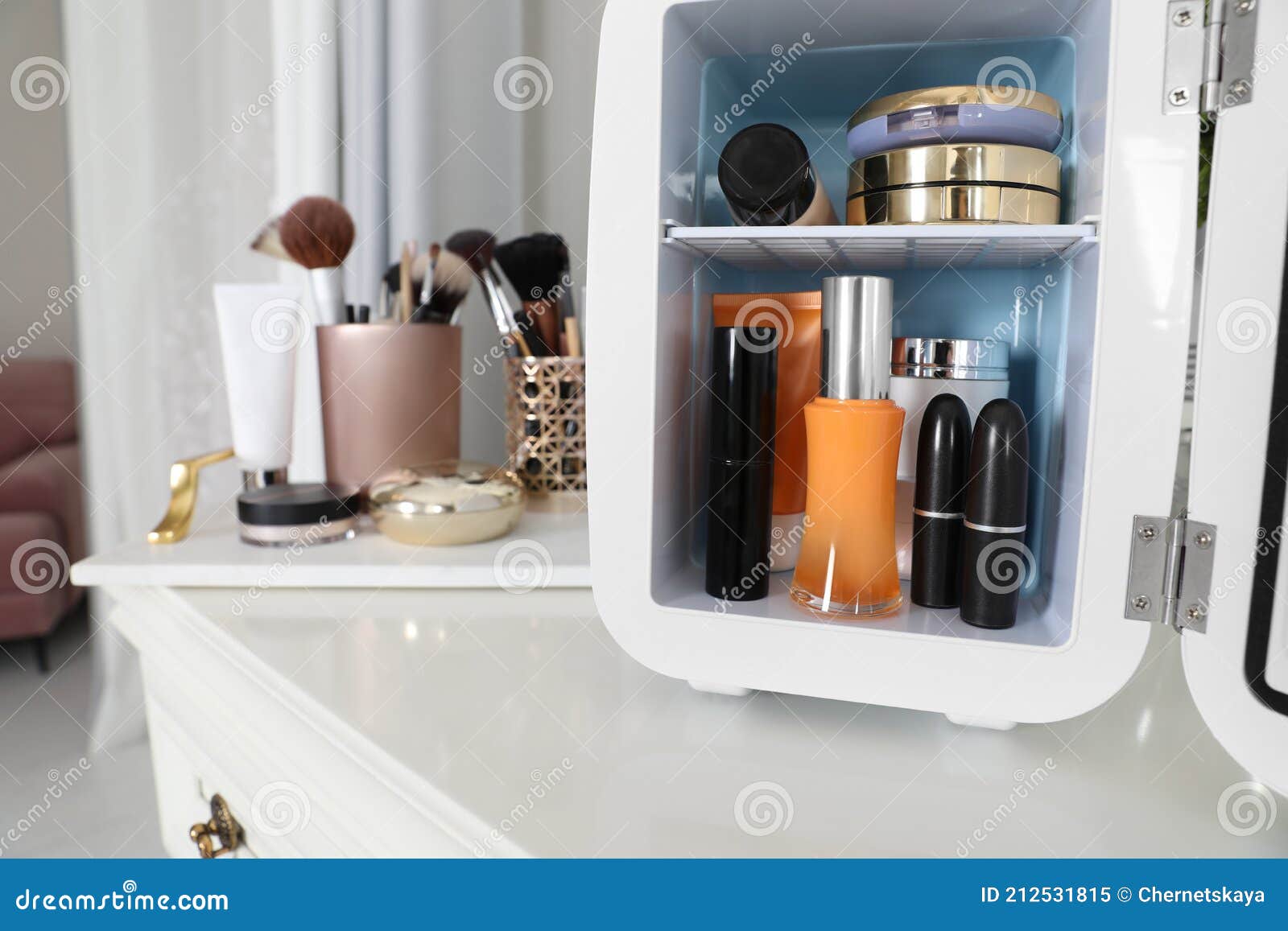 Mini Fridge with Cosmetic Products on White Vanity Table Stock Image ...
