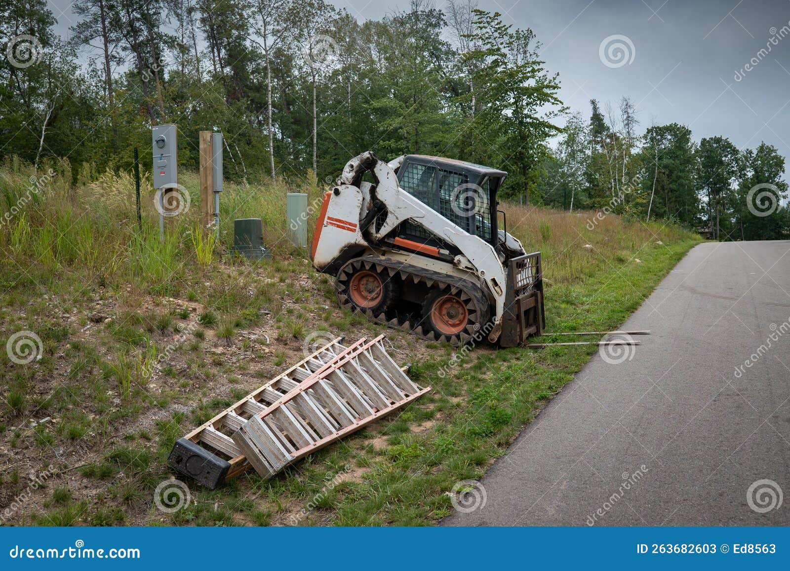 Mini Front End Loader with Forklift Attachment at Construction Site ...