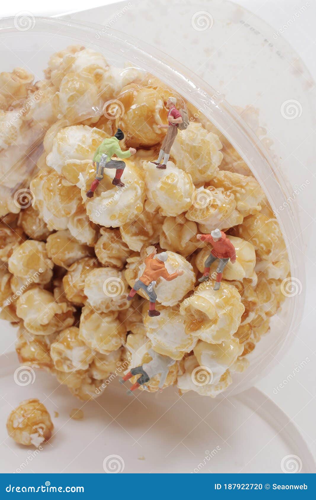 A Mini and Fun Figure Climb the Popcorn Wall Stock Photo - Image of ...