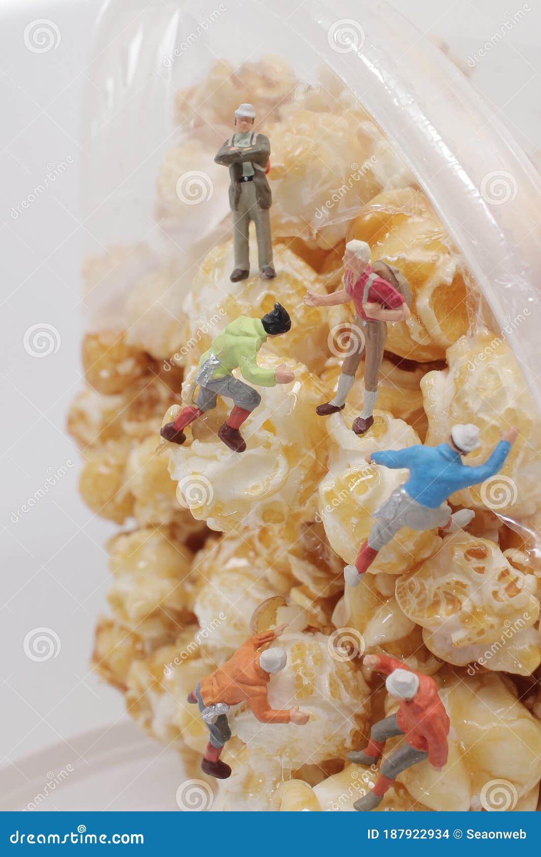 A Mini and Fun Figure Climb the Popcorn Wall Stock Photo - Image of ...