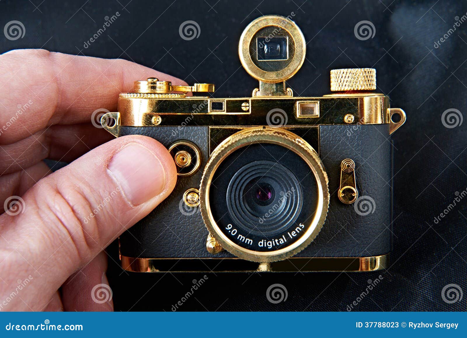 Mini Gift Golden Camera in Big Hand Stock Image - Image of black ...