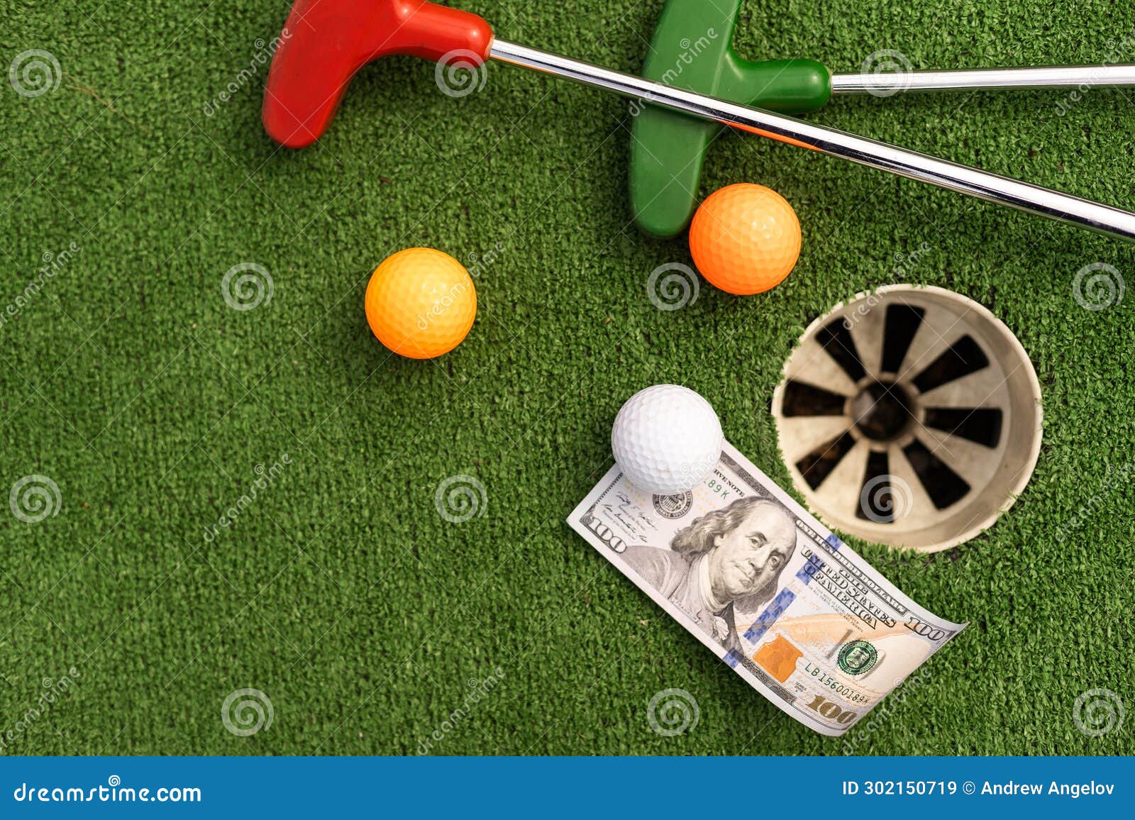 Mini Golf Club, Ball and Money on the Artificial Grass Stock Image ...