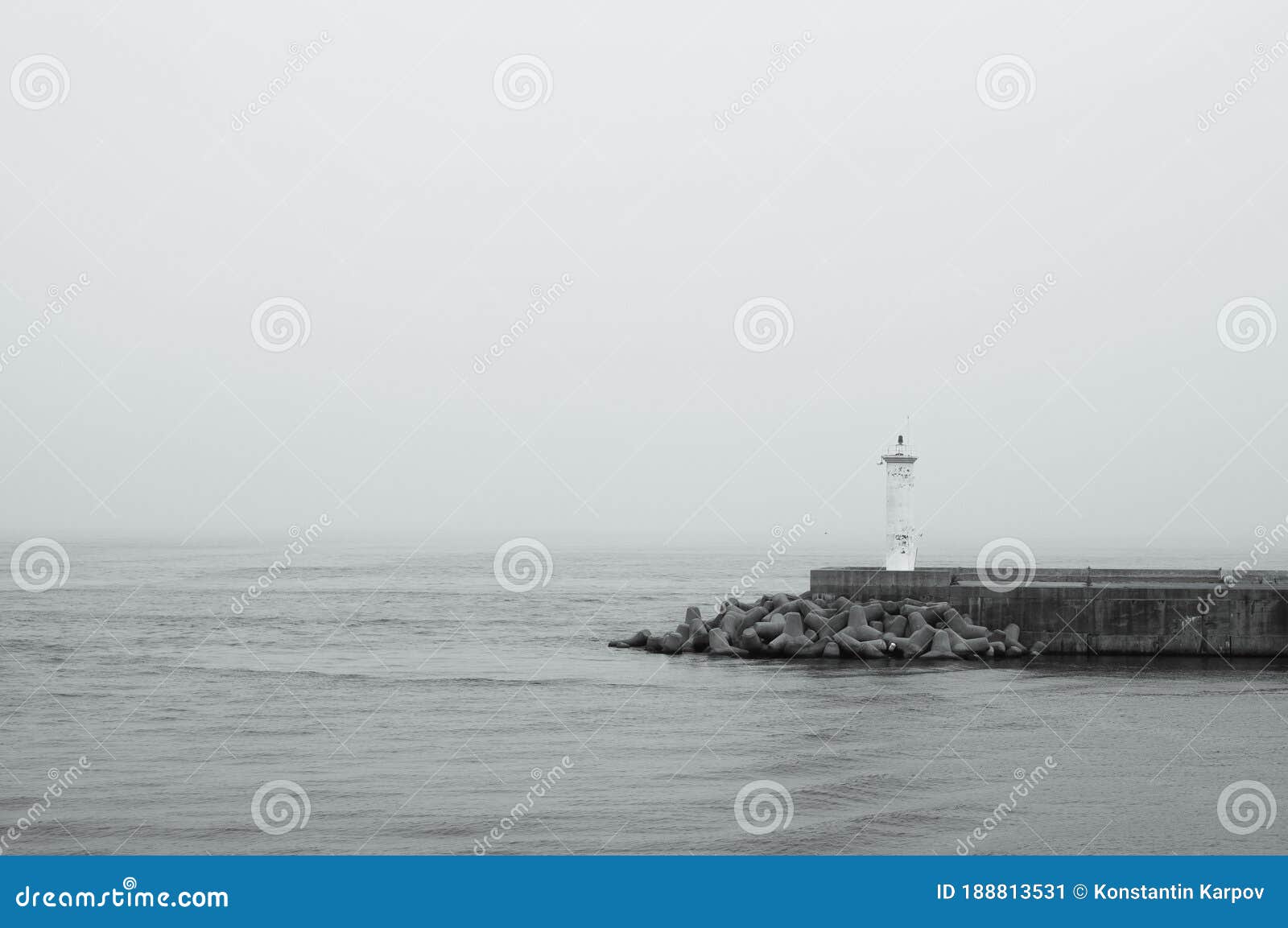 Mini Lighthouse on the Coast. Small Lighthouse on the Pier in Black and ...
