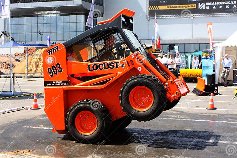 Mini loader Locust editorial stock image. Image of demonstration - 19735264