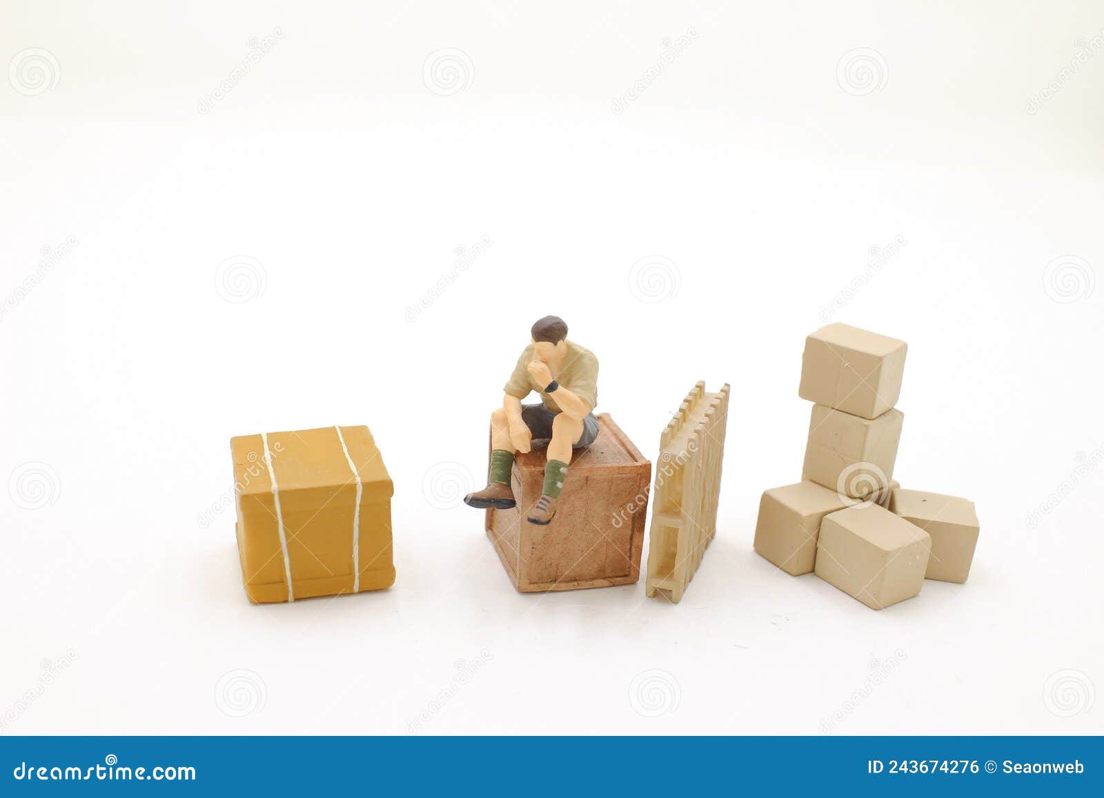 A Mini Man Sitting Down on a White Background Stock Photo - Image of ...