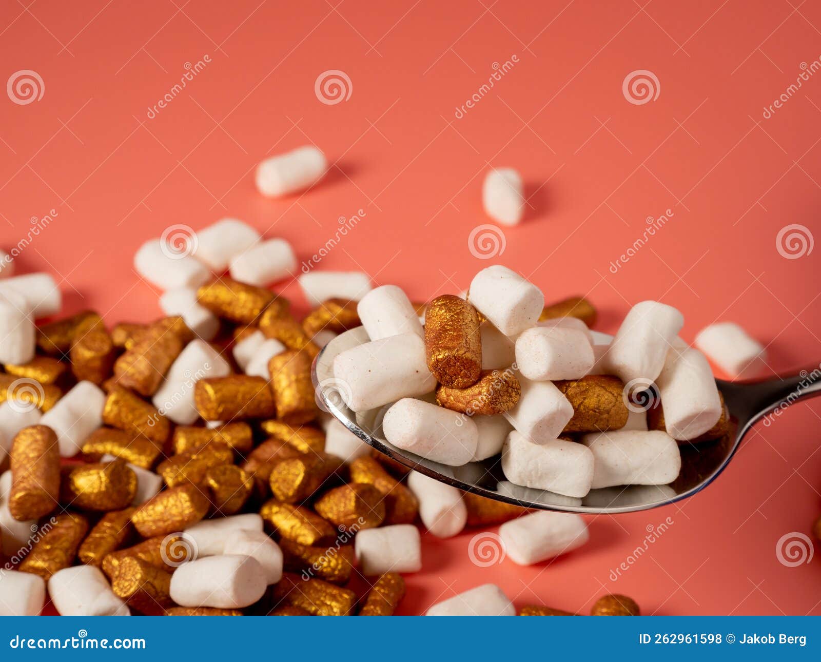 Mini Marshmallows on a Pink Background. Marshmallow Gold and White ...