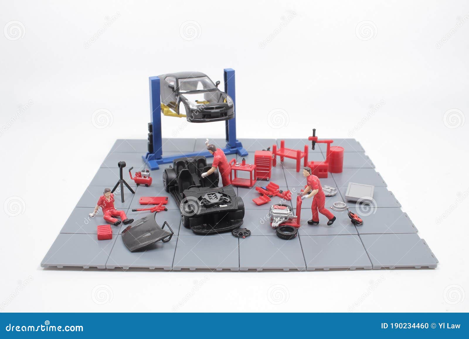 A Mini Mechanics Repairing Toy Car,concept of the Workshop Stock Photo ...