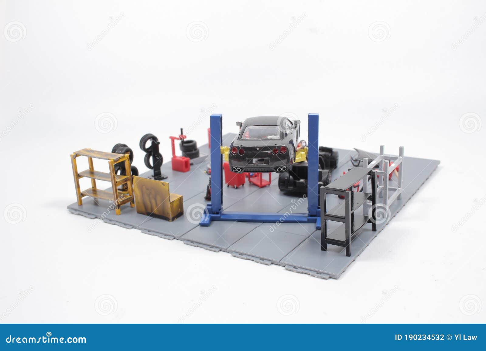 A Mini Mechanics Repairing Toy Car,concept of the Workshop Stock Photo ...