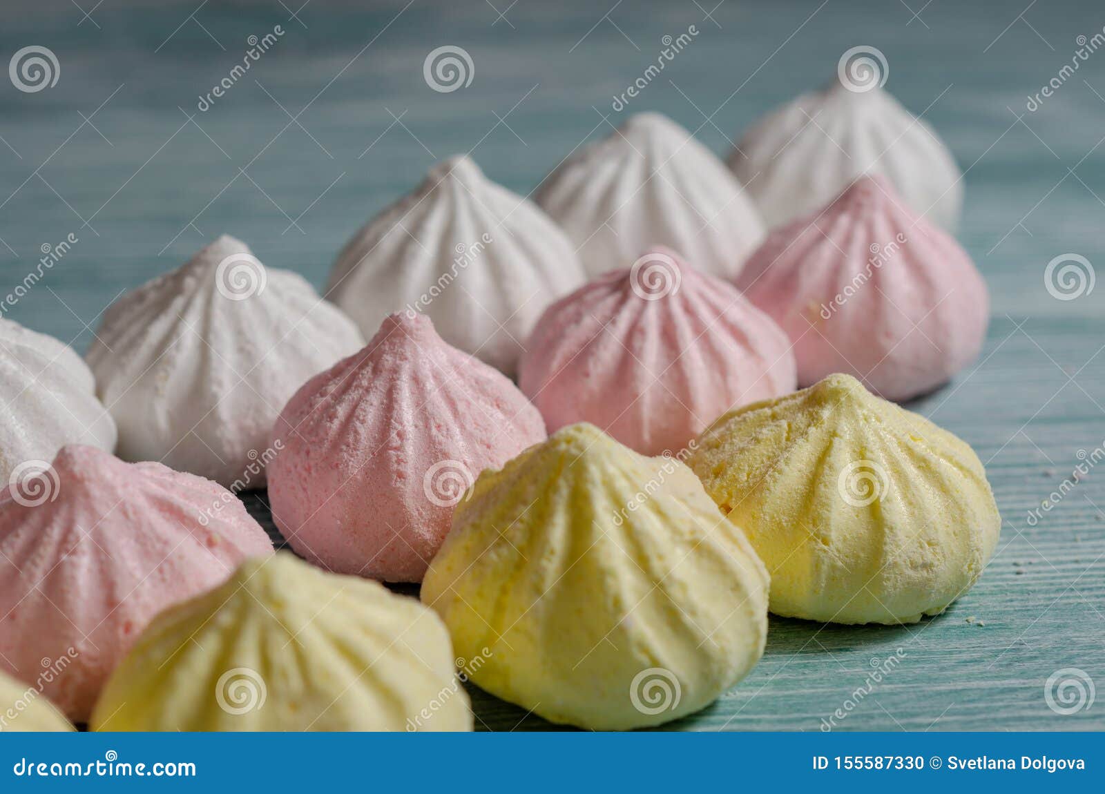 Mini Meringues of Pastel Colors on Light Blue Background Stock Photo ...