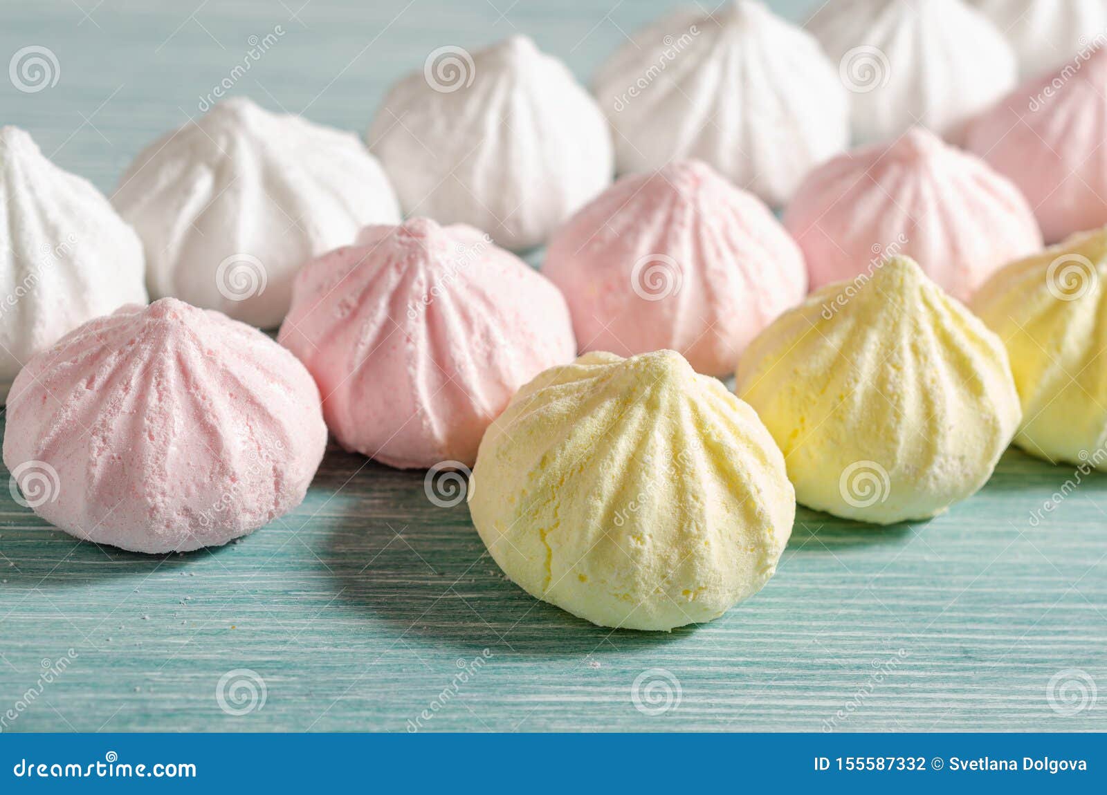 Mini Meringues of Pastel Colors on Light Blue Background Stock Photo ...