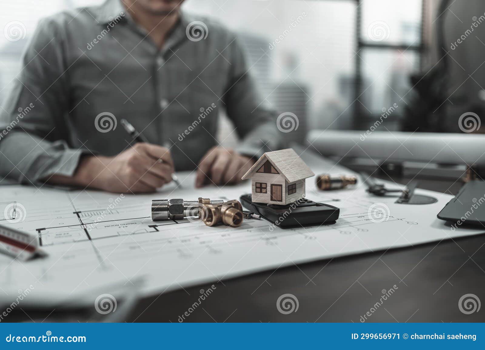 Mini Model House on Calculator and Them on Blueprint House Plan Design ...