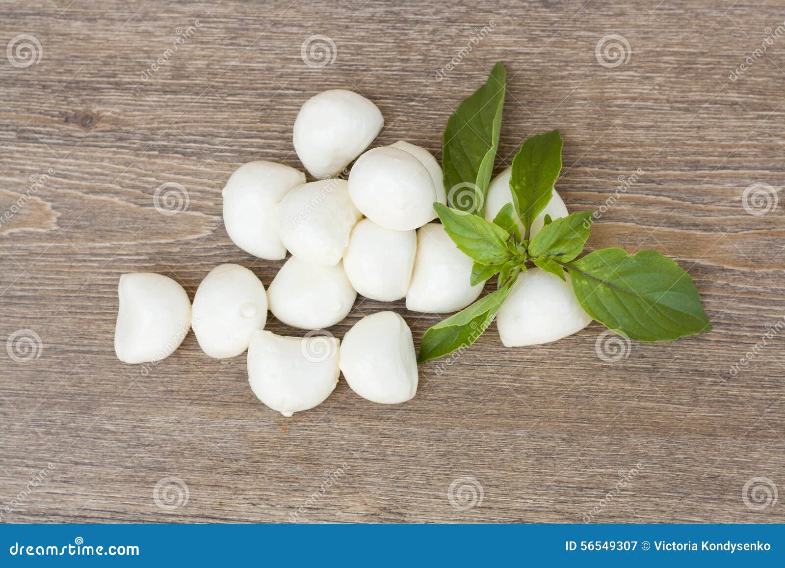 Mini Mozzarella Balls with Green Basil Leaves, Horizontal Shot Stock ...