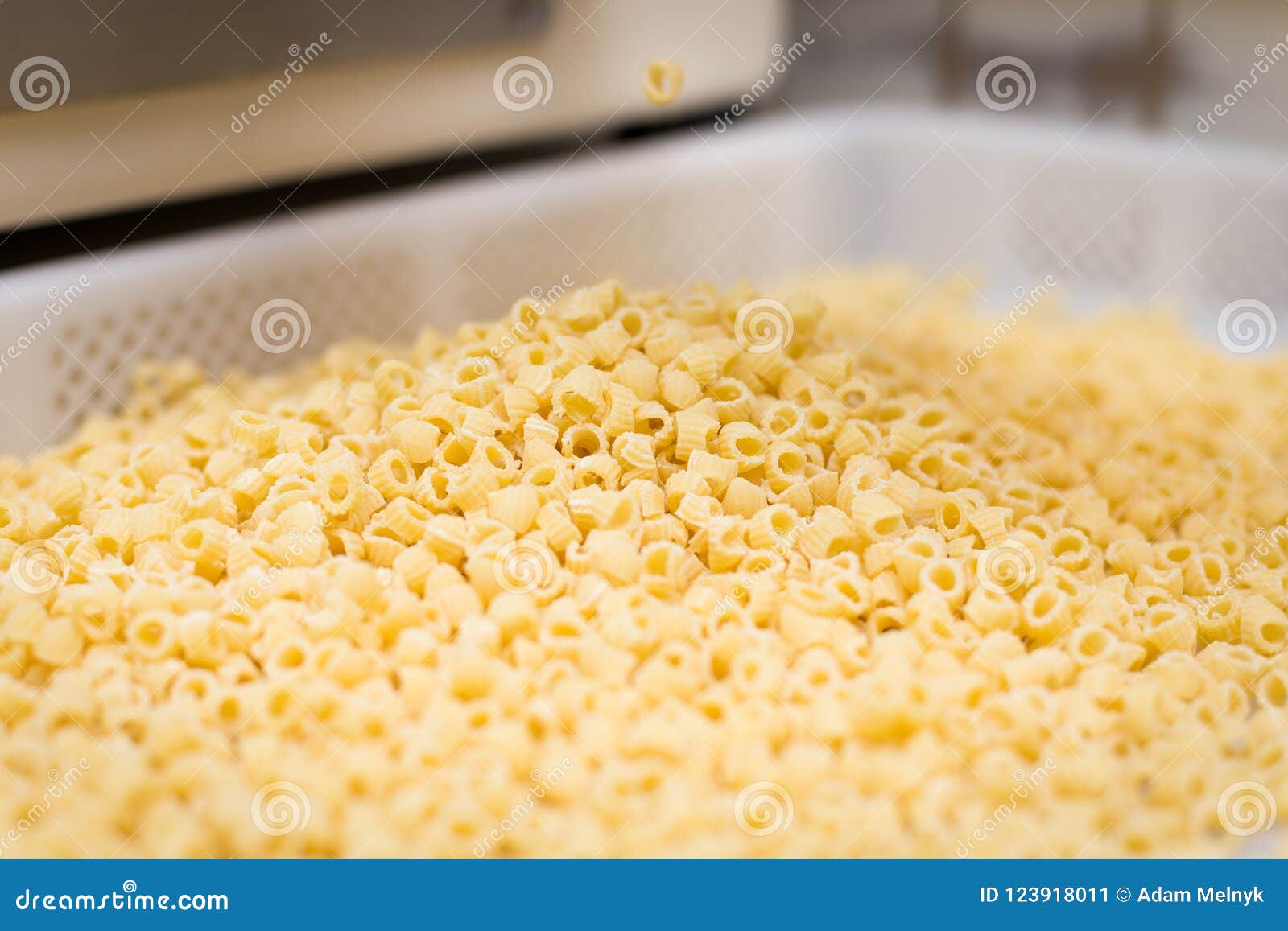 Mini Penne Pasta Being Cut Using a Die Cutter. Stock Image - Image of ...