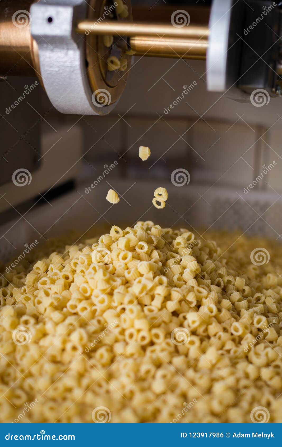 Mini Penne Pasta Being Cut Using a Die Cutter. Stock Photo - Image of ...