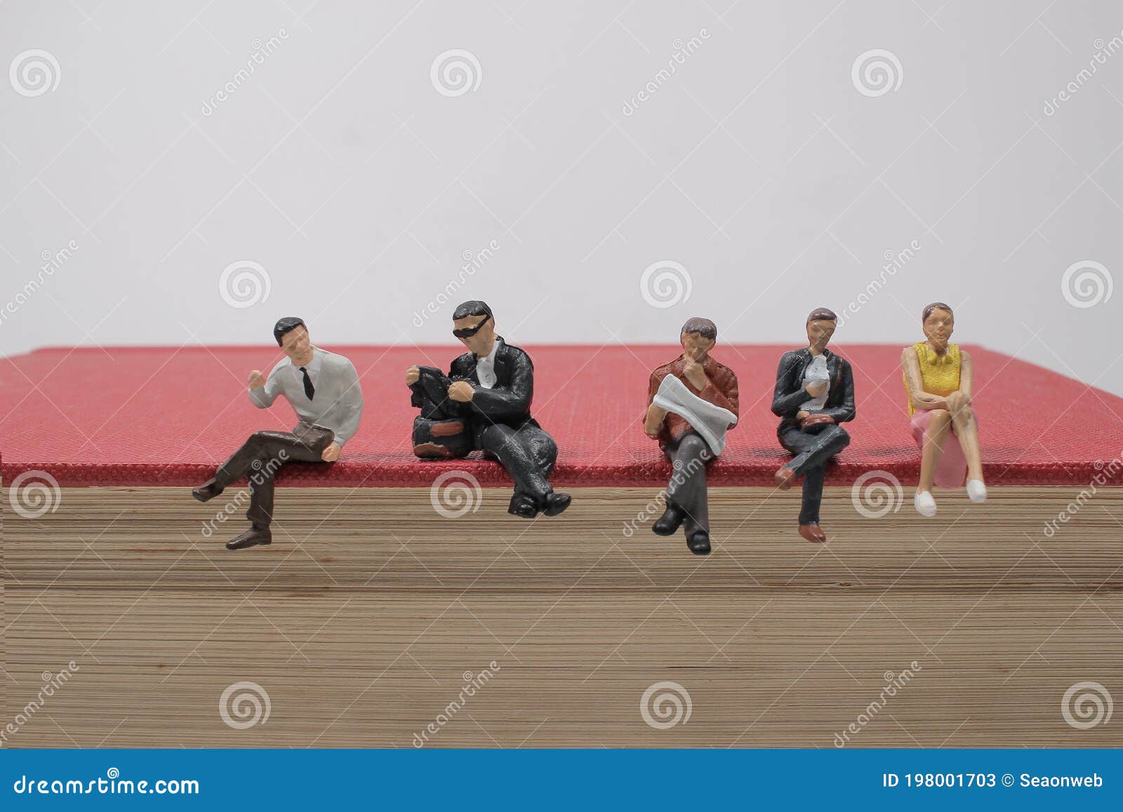 Mini People Sitting on Paper Using As Education and Social Background ...