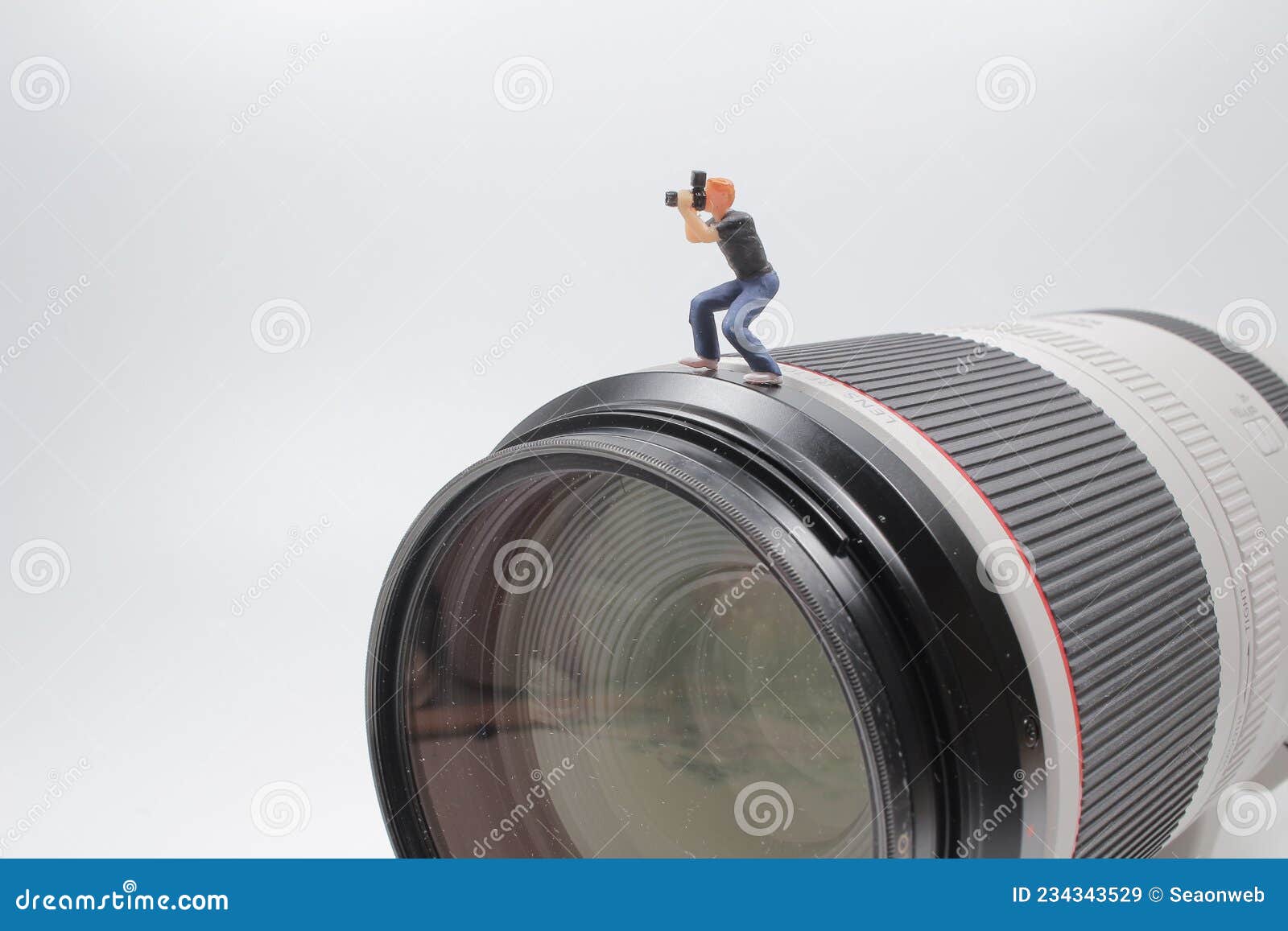 A Mini Photographer Standing on a Camera Lens Stock Image - Image of ...