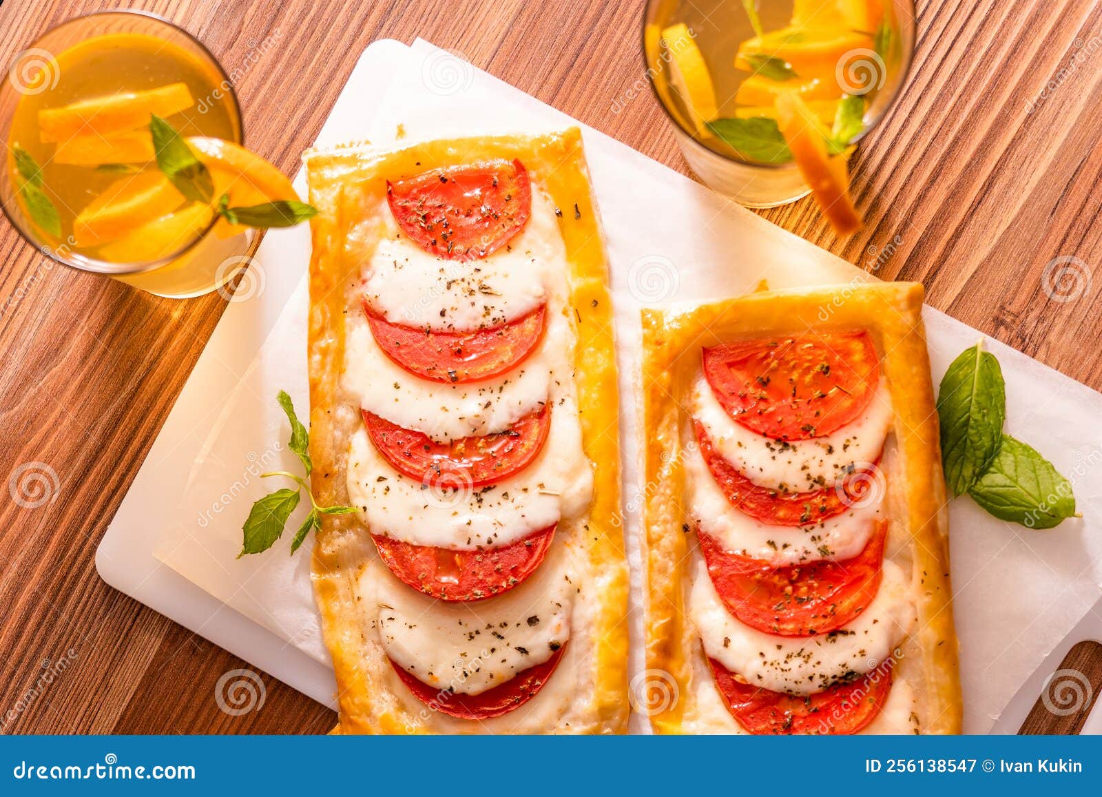 Mini Pizza with Tomatoes and Mozzarella. Homemade Lemonade with Mint ...