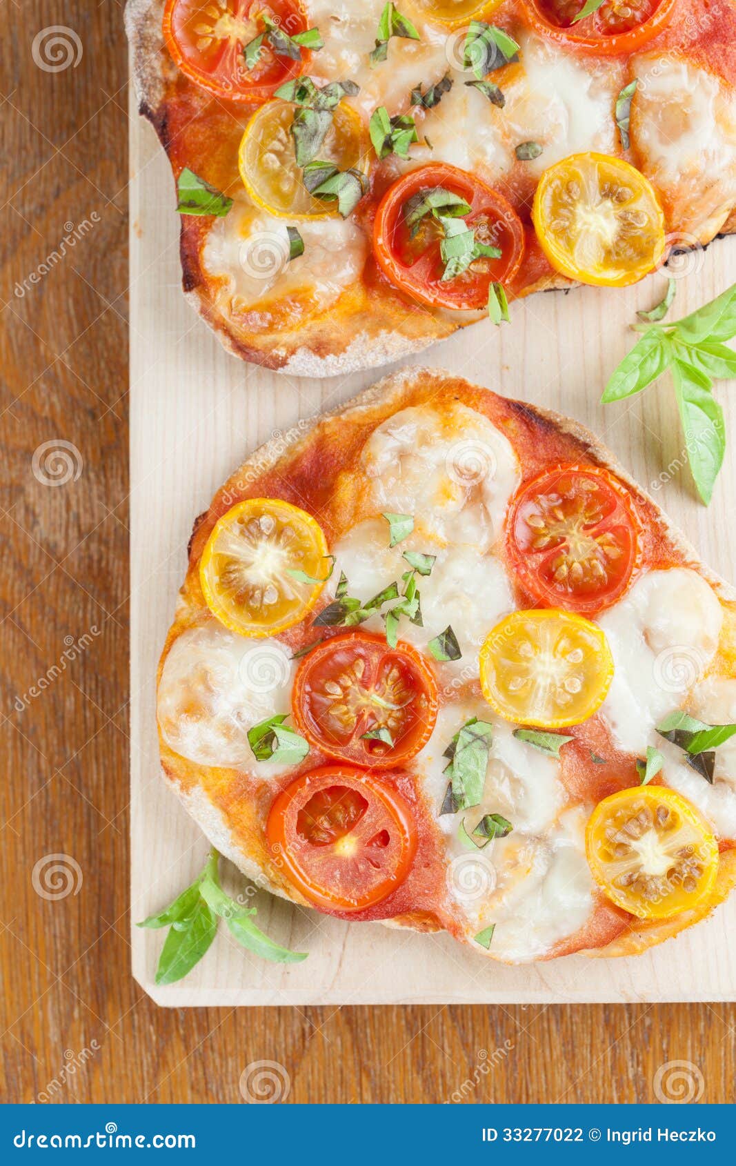 Mini Pizzas with Mozzarella and Cherry Tomatoes Stock Photo - Image of ...