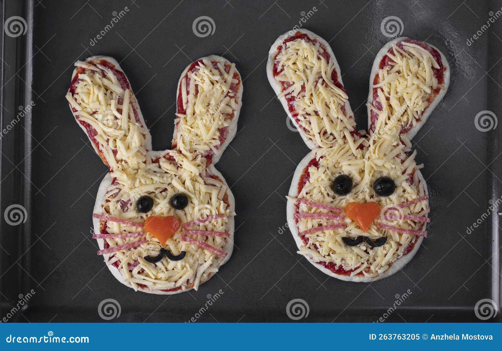 Mini Pizzas in the Shape of a Rabbit before Baking on Baking Sheet ...