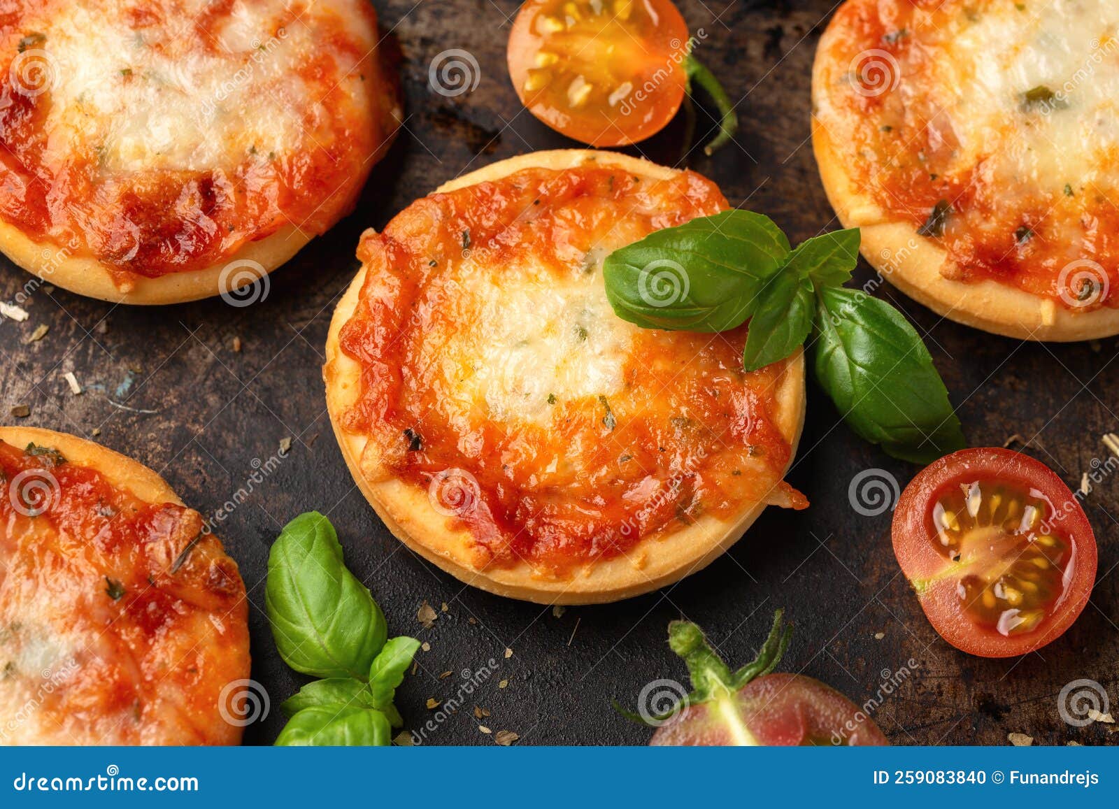 Mini Pizzas with Tomatoes and Mozzarella Cheese Stock Photo - Image of ...