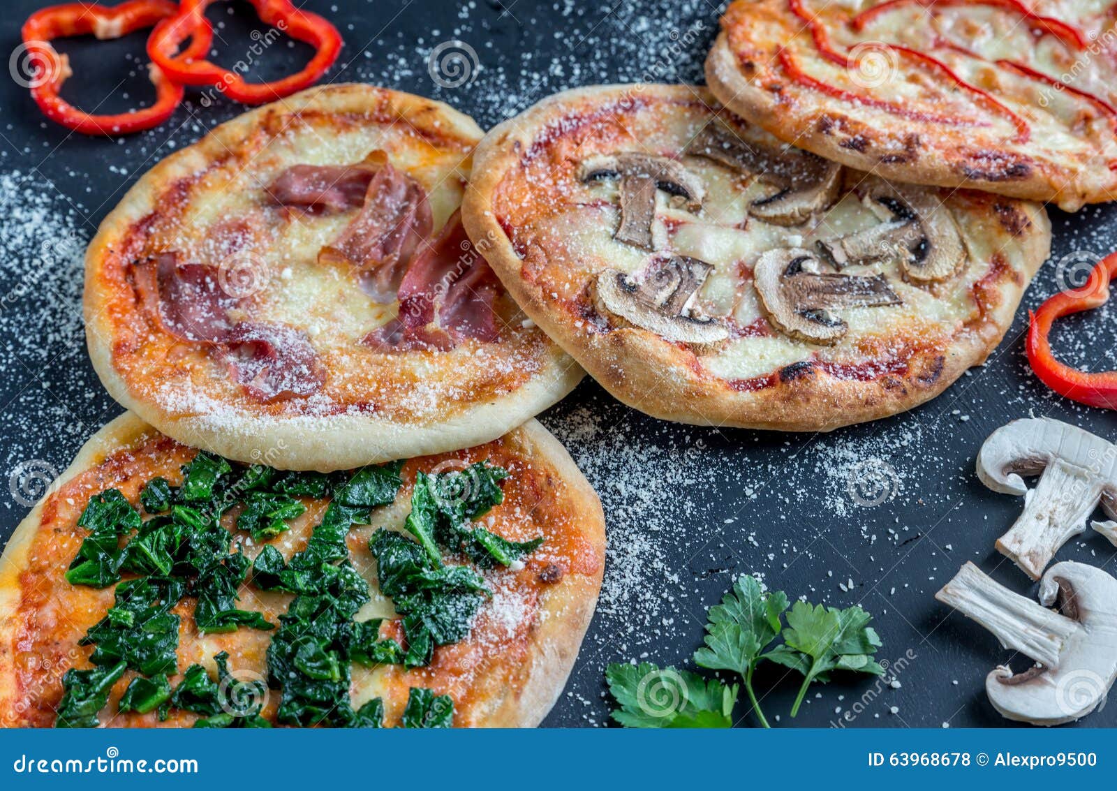 Mini Pizzas with Various Toppings on the Wooden Board Stock Photo ...