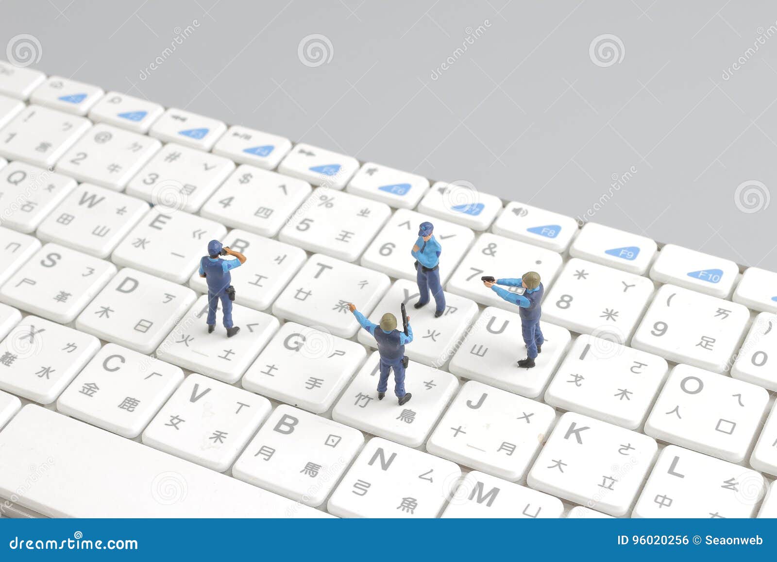 Mini Police Squad Protecting Laptop Computer Stock Photo - Image of ...