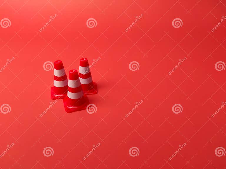 Mini Red Plastic Cones on a Red Background Stock Photo - Image of road ...