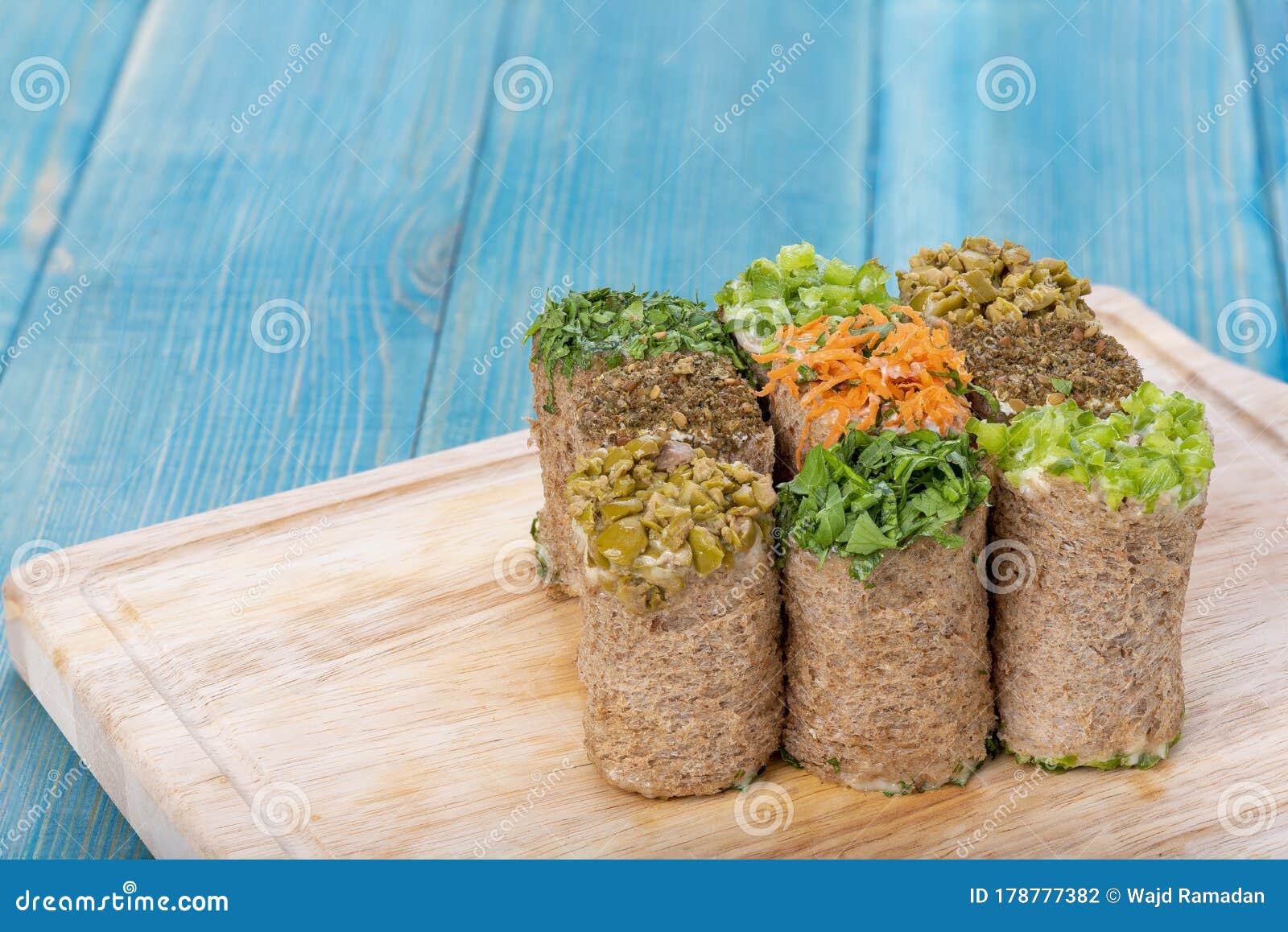 Mini Rolls Using Toast Sandwiches, Mixed Toast Rolls on Blue Wood ...