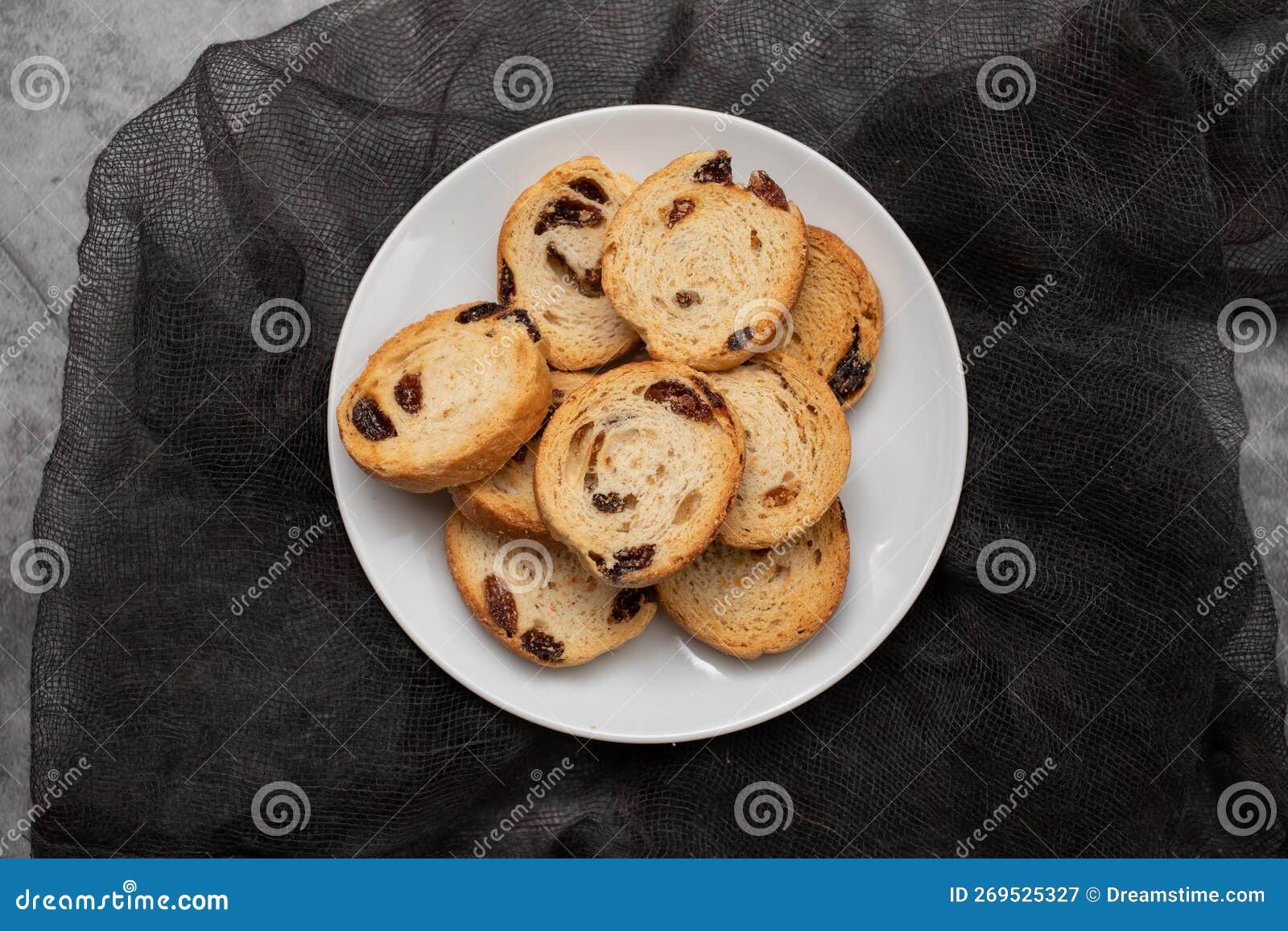 Mini Round Toasts of Bread with Raisins on Dish Stock Image - Image of ...