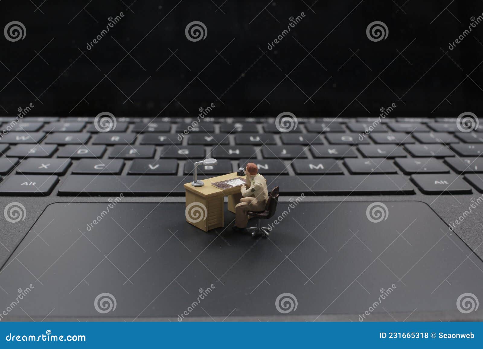 A Mini of Security Figure are Working on Laptop Stock Photo - Image of ...