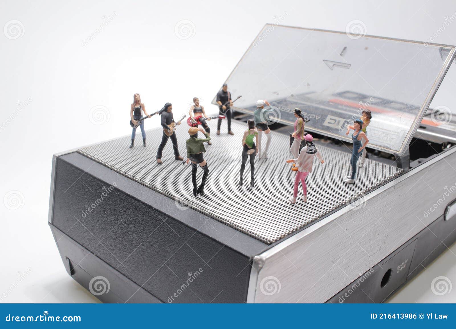 A Mini Singer and Guitar Player Standing on Speaker Stock Photo - Image ...