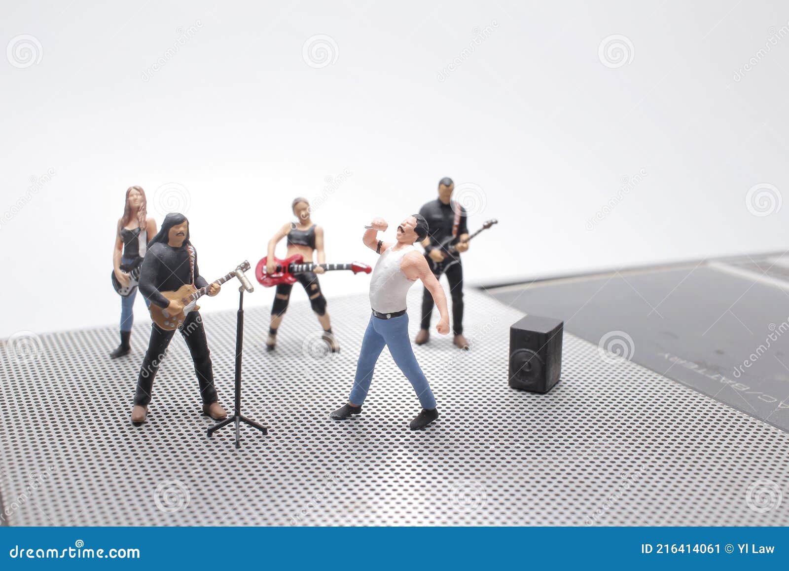 A Mini Singer and Guitar Player Standing on Speaker Stock Image - Image ...