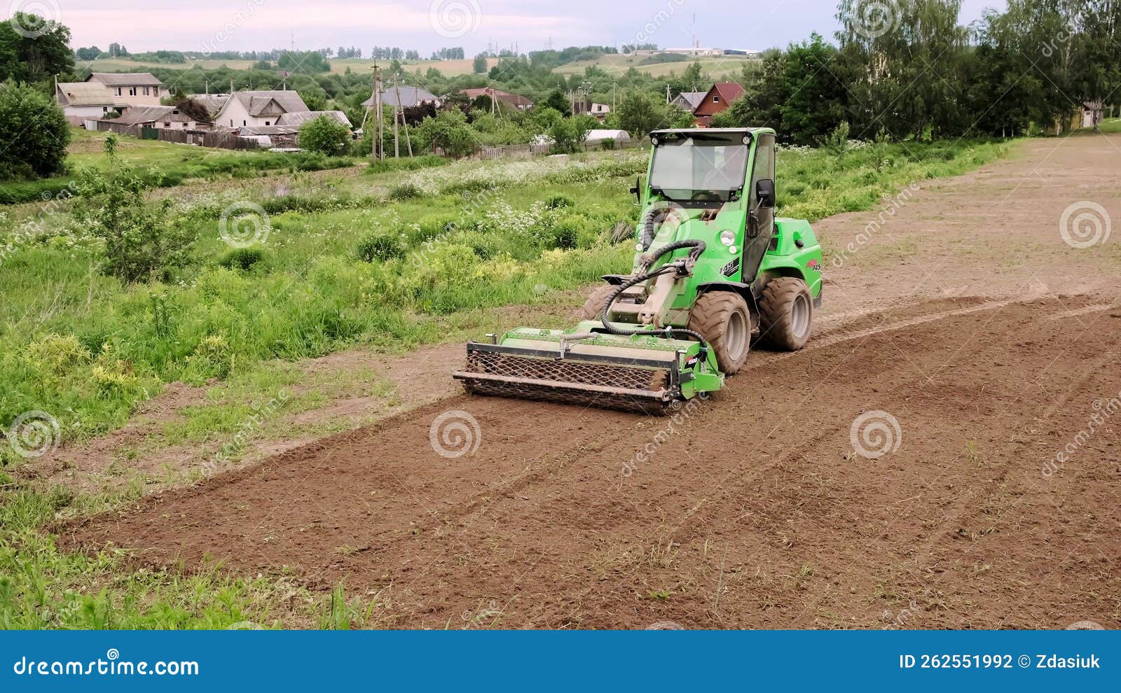 Mini Skid Steer Loader Clear the Construction Site. Land Work. Rotary ...