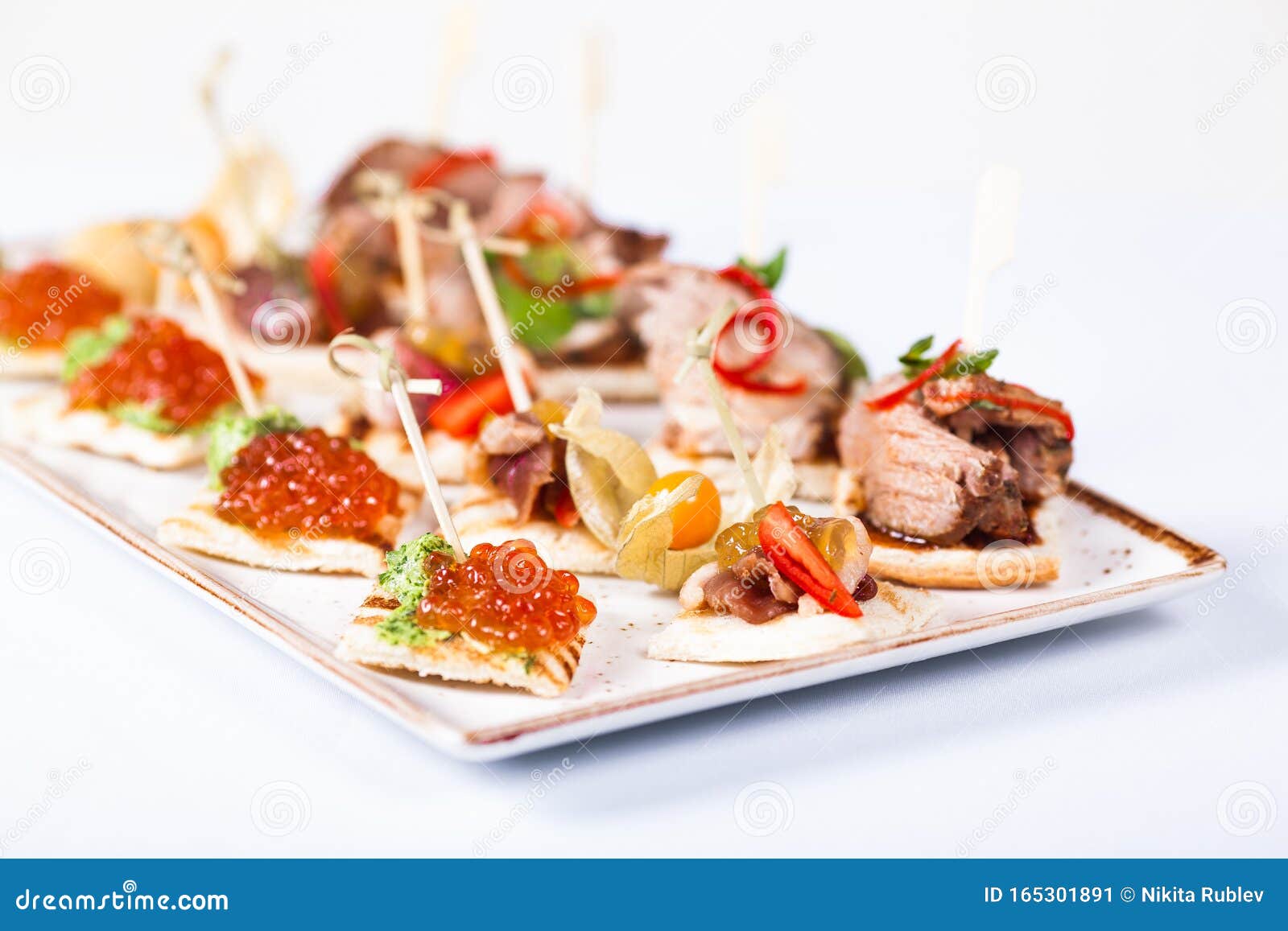 Mini Snacks Tapas with Caviar and Meat on White Plate Stock Image ...
