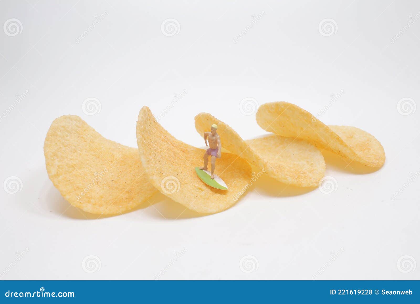 A Mini of Surfer , Surfing on Potato Chip Stock Photo - Image of salted ...