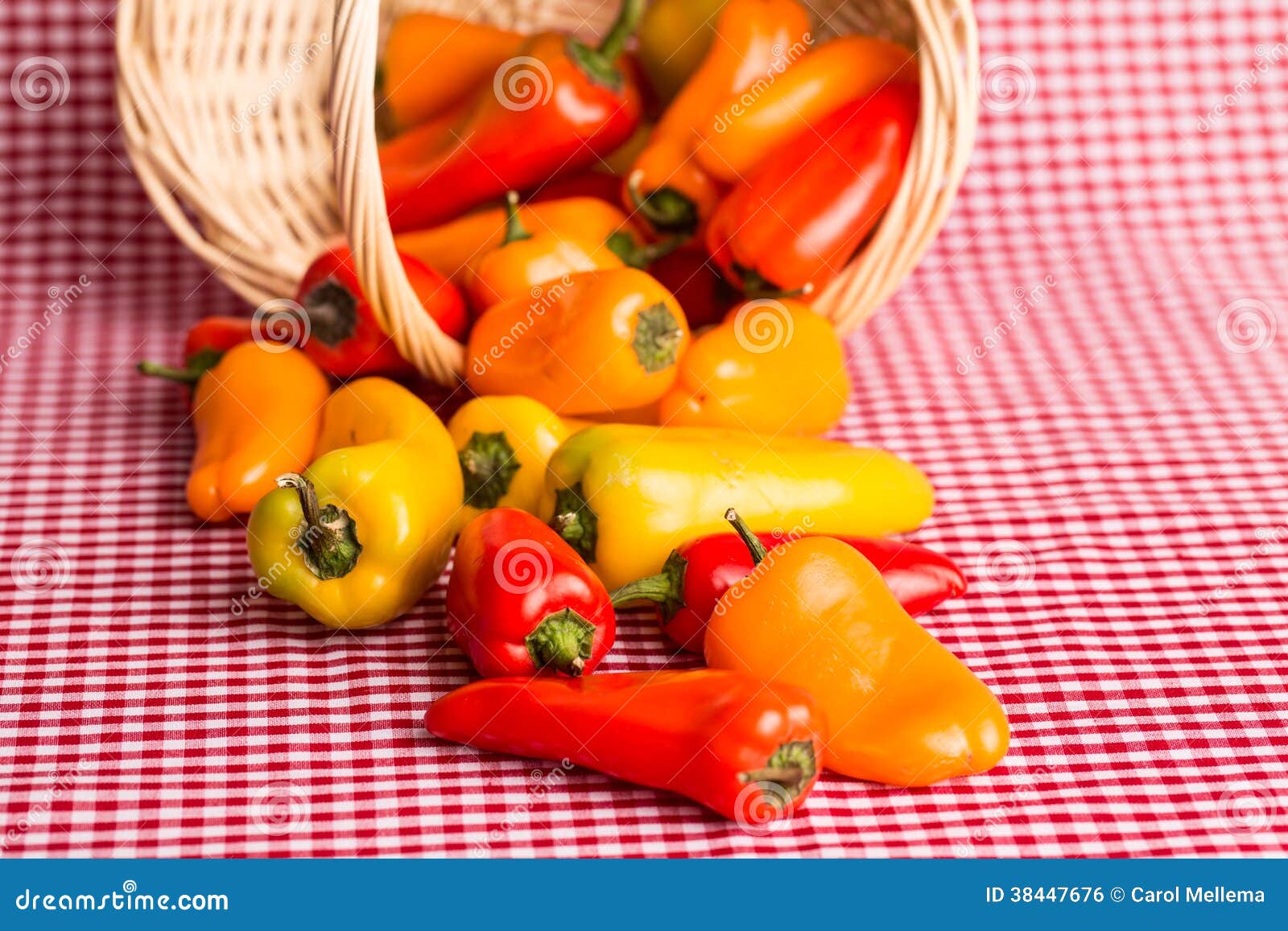 Mini Sweet Bell Peppers Spilling Out of Wicker Basket Stock Photo ...