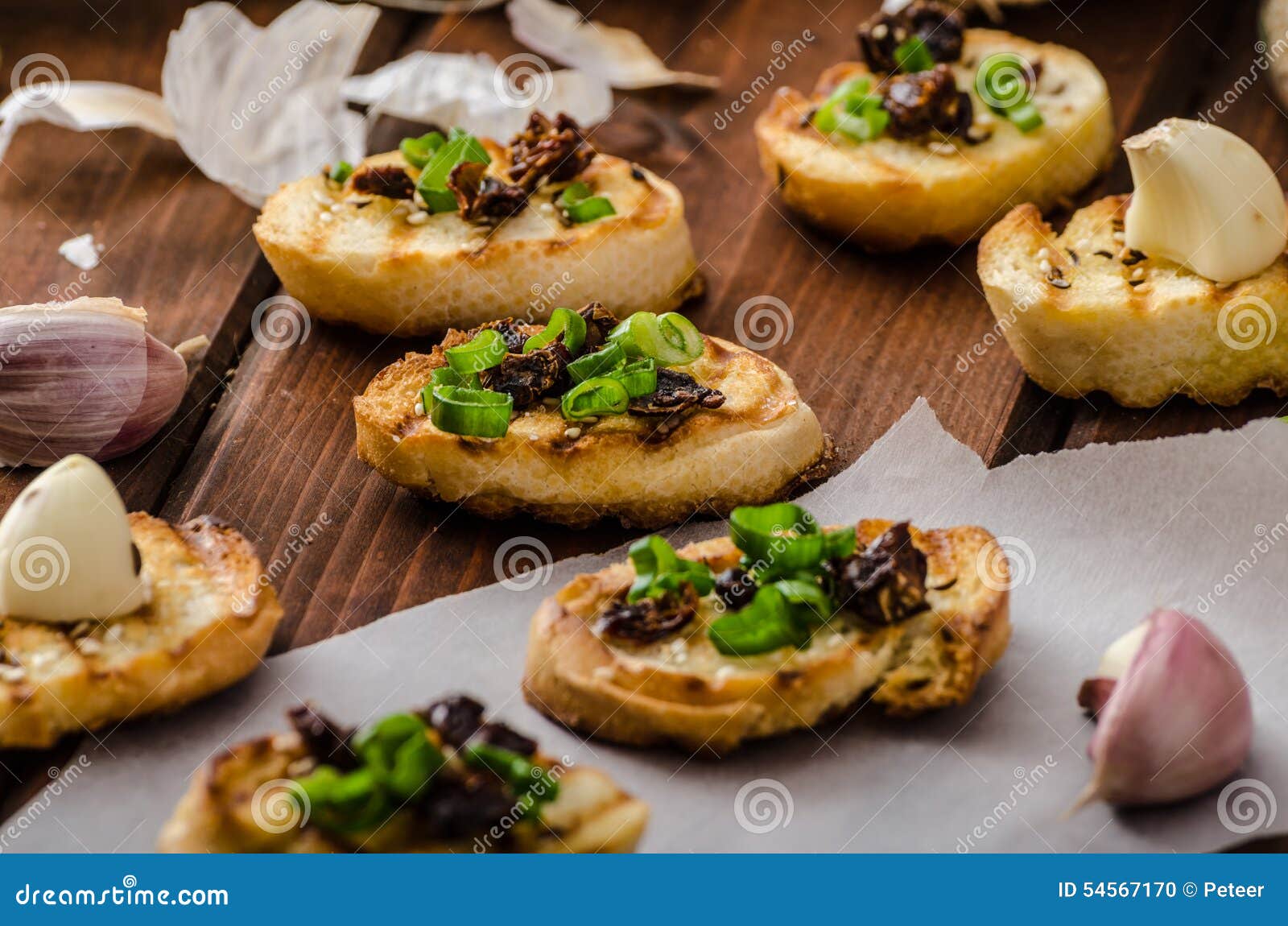 Mini Toasts with Garlic and Dried Tomato Stock Photo - Image of dried ...