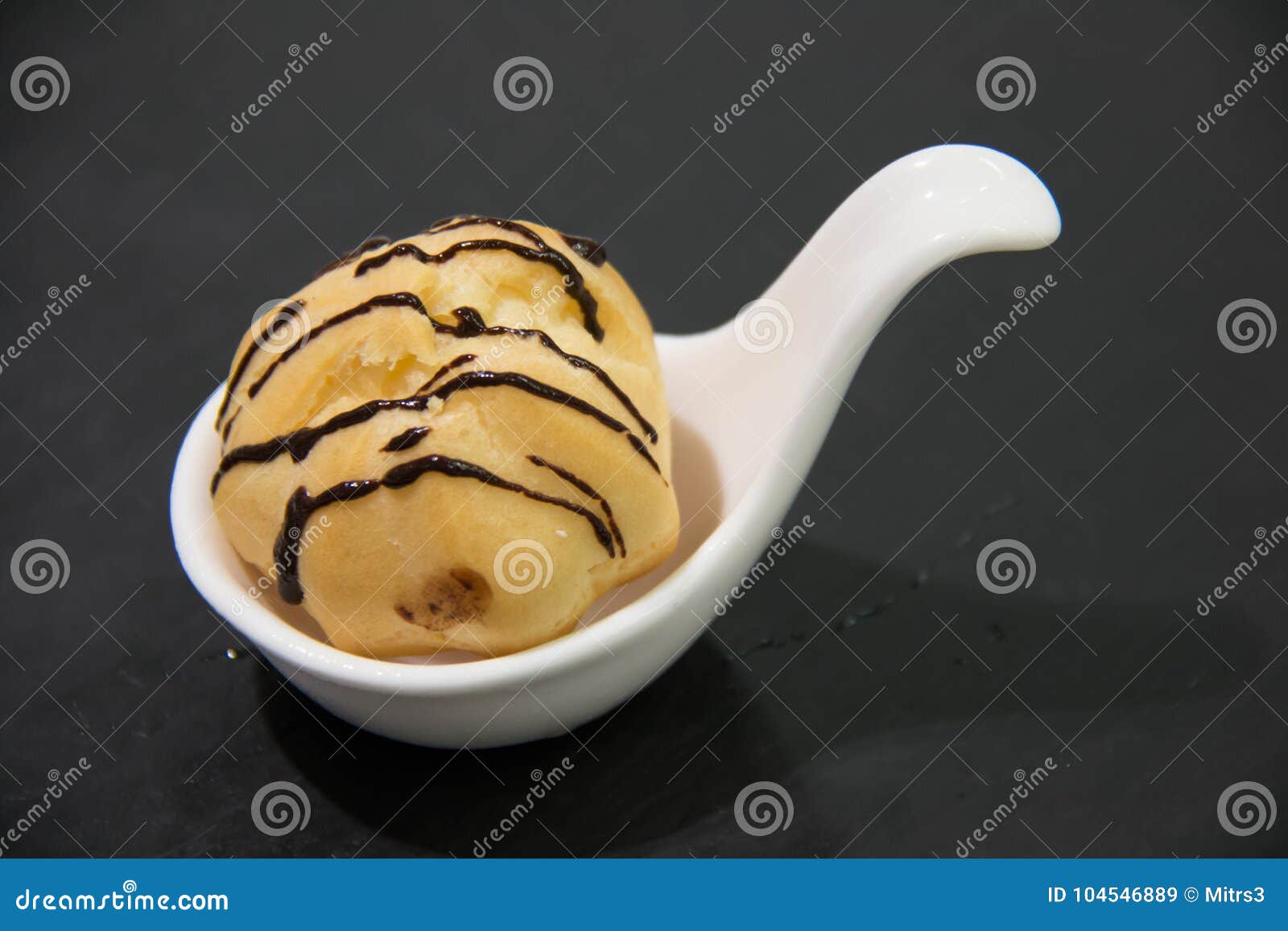 Mini Vanilla Eclair Balls with Chocolate Sauce for Party Stock Image ...