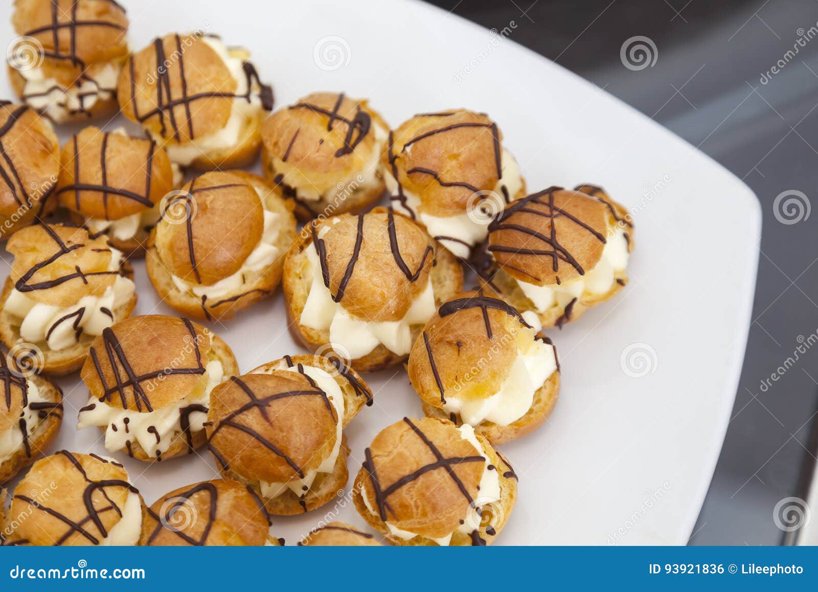 Mini Vanilla Eclair Balls with Chocolate Sauce. Stock Photo - Image of ...