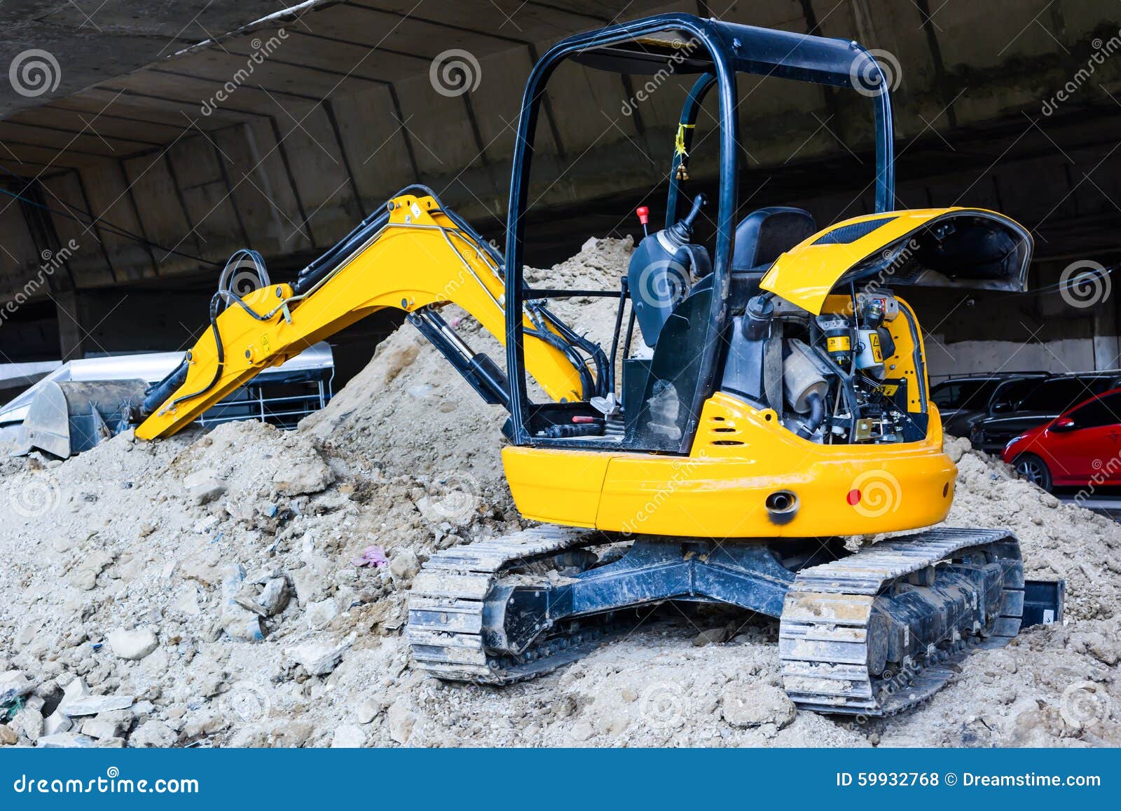 Mini Yellow Excavator on a Construction Site Stock Photo - Image of ...