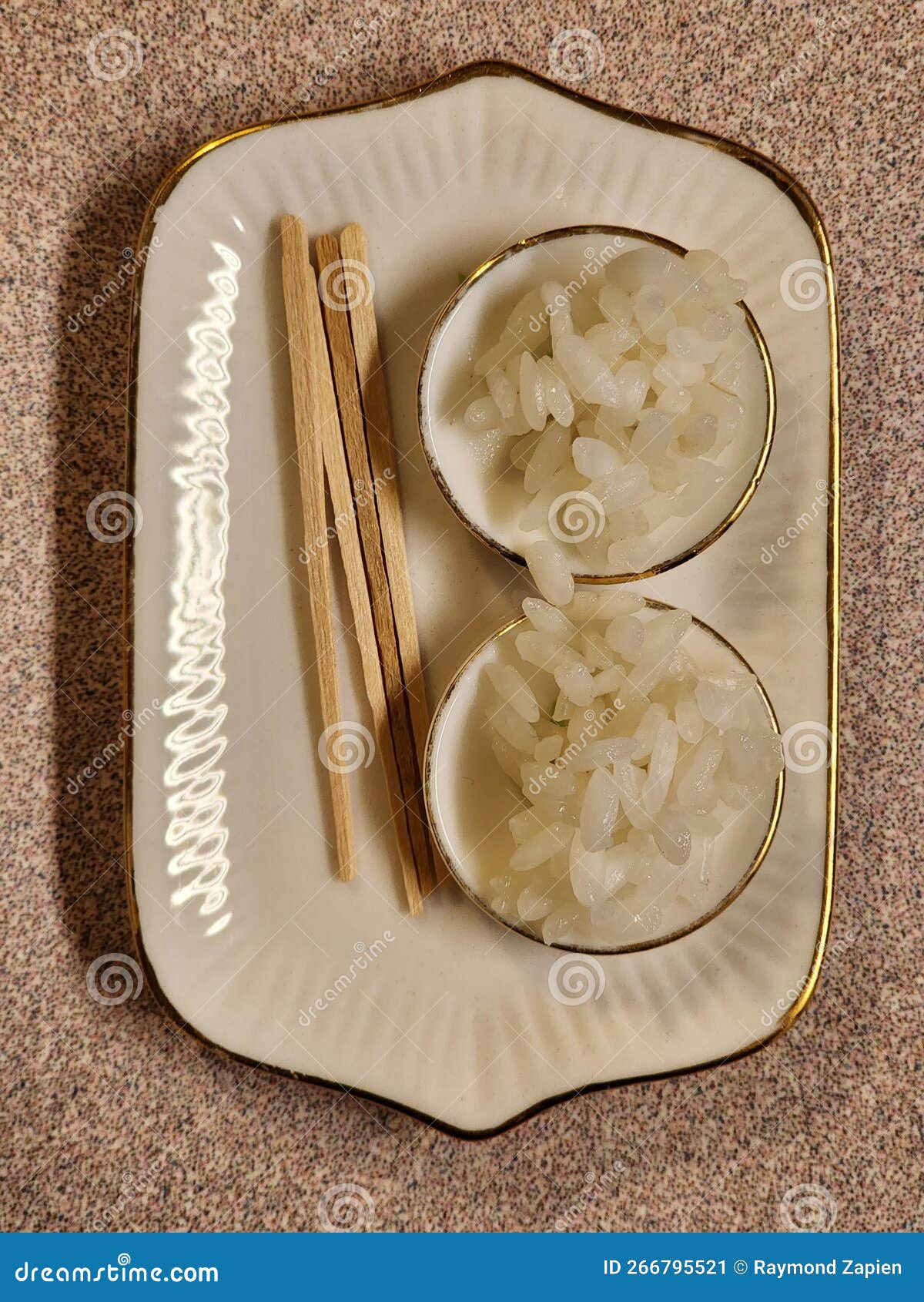 Miniature Bowls of Rice on a Tea Plate with Chopsticks Stock Image ...